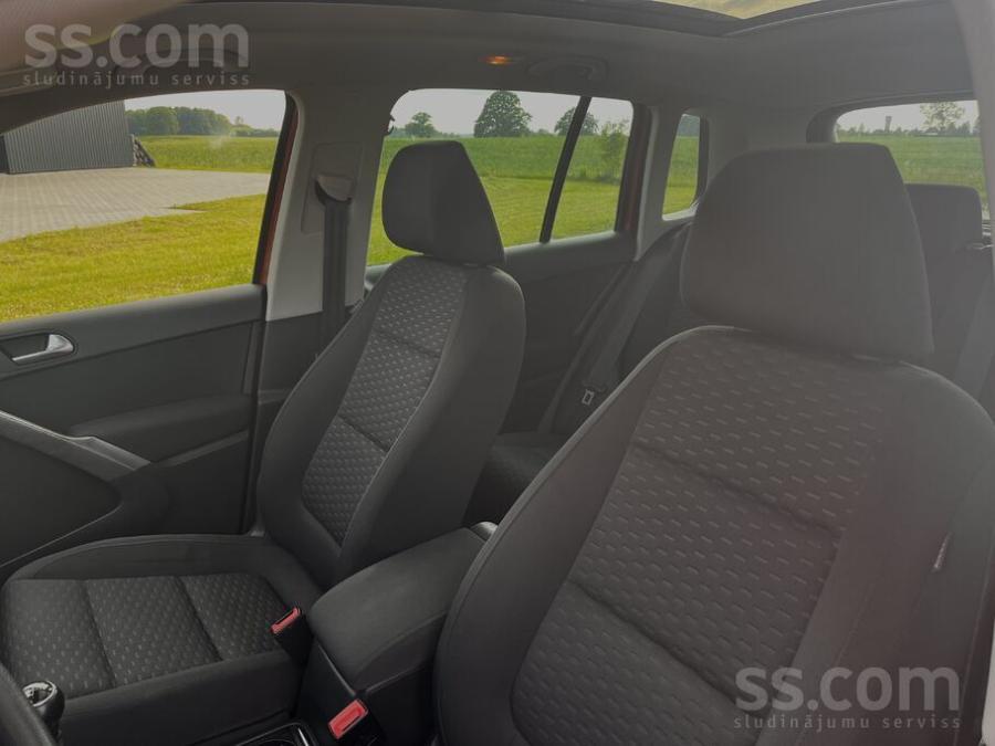 Red Volkswagen Tiguan 2009 in Talsi, with an engine capacity of 2.00 L and mileage of 244 thousand km for 6200 €, photo 23 on AUTOMOTO.COM.LV