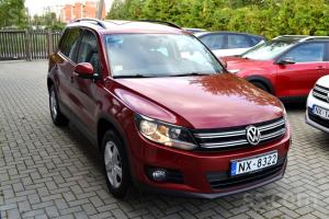 Red Volkswagen Tiguan 2012 in Riga, with an engine capacity of 1.40 L and mileage of 255 thousand km for 6990 €, photo 3 on AUTOMOTO.COM.LV
