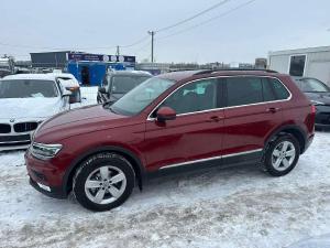 Red Volkswagen Tiguan 2016 in Kaunas, with an engine capacity of 1.97 L and mileage of 203 thousand km for 15900 €, photo 9 on AUTOMOTO.COM.LV