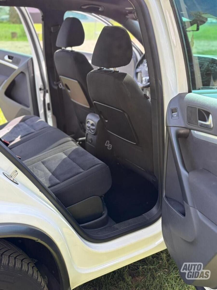 White Volkswagen Tiguan 2015 in Panevezys, with an engine capacity of 1.40 L and mileage of 267 thousand km for 8150 €, photo 18 on AUTOMOTO.COM.LV