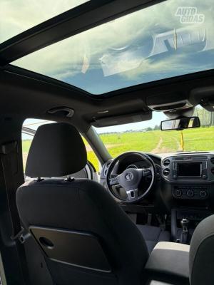 White Volkswagen Tiguan 2015 in Panevezys, with an engine capacity of 1.40 L and mileage of 267 thousand km for 8150 €, photo 21 on AUTOMOTO.COM.LV
