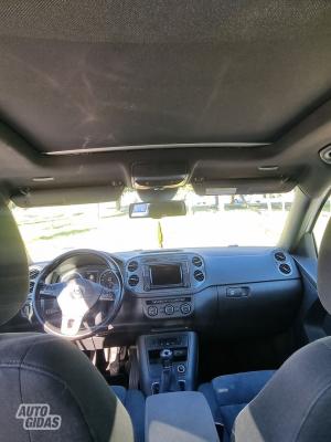White Volkswagen Tiguan 2015 in Panevezys, with an engine capacity of 1.40 L and mileage of 267 thousand km for 8150 €, photo 29 on AUTOMOTO.COM.LV