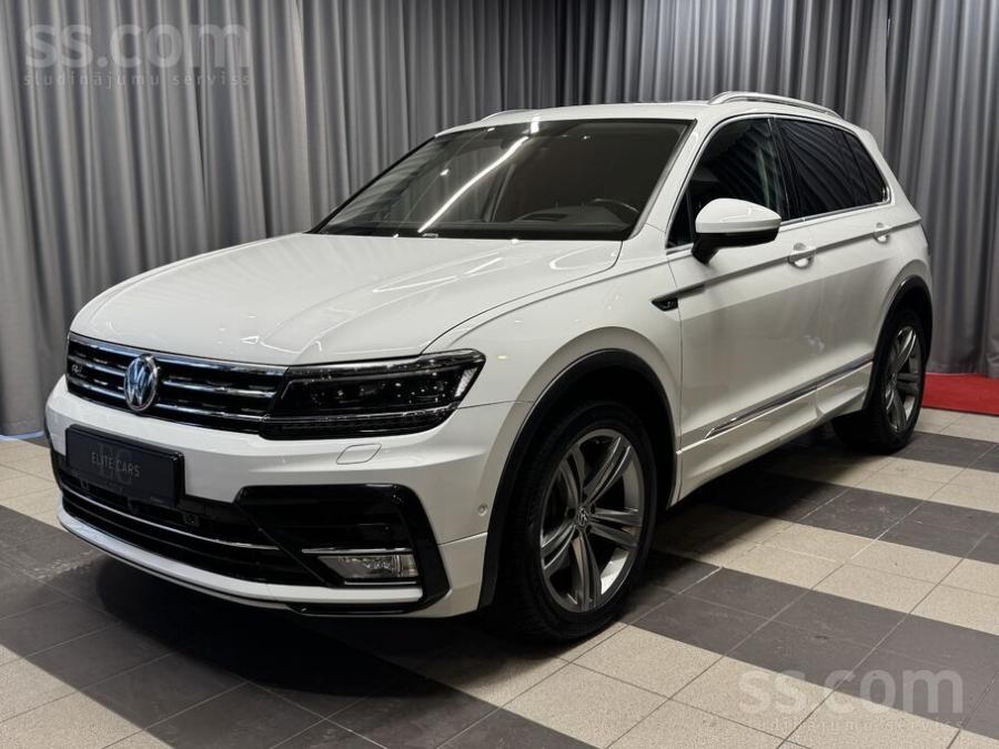 White Volkswagen Tiguan 2016 in Riga, with an engine capacity of 2.00 L and mileage of 223 thousand km for 17990 €, photo 1 on AUTOMOTO.COM.LV
