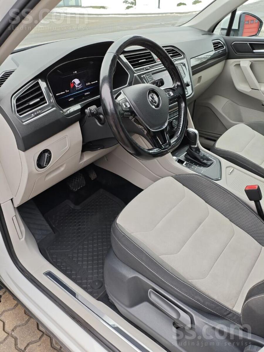 White Volkswagen Tiguan 2016 in Riga, with an engine capacity of 2.00 L and mileage of 279 thousand km for 14699 €, photo 4 on AUTOMOTO.COM.LV