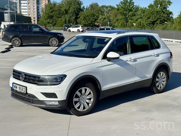 White Volkswagen Tiguan 2016 in Riga, with an engine capacity of 2.00 L and mileage of 304 thousand km for 11600 €, photo 1 on AUTOMOTO.COM.LV