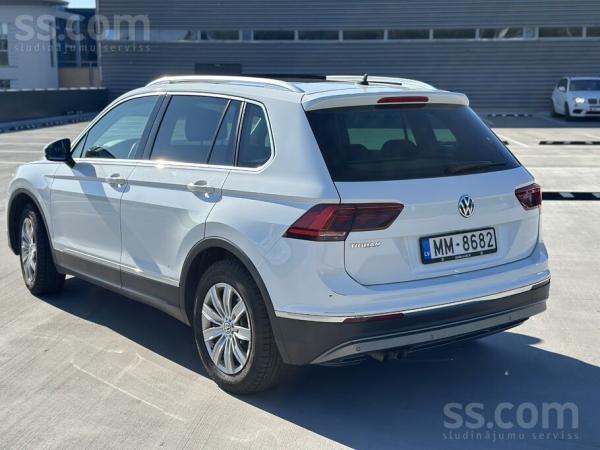 White Volkswagen Tiguan 2016 in Riga, with an engine capacity of 2.00 L and mileage of 304 thousand km for 11600 €, photo 4 on AUTOMOTO.COM.LV