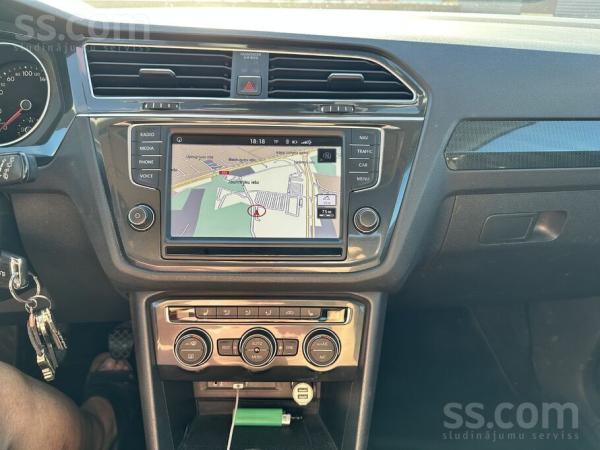 White Volkswagen Tiguan 2016 in Riga, with an engine capacity of 2.00 L and mileage of 304 thousand km for 11600 €, photo 6 on AUTOMOTO.COM.LV