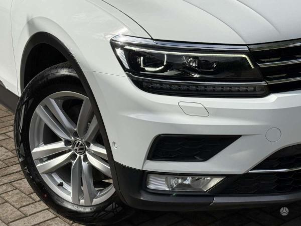White Volkswagen Tiguan 2016 in Prienai, with an engine capacity of 1.97 L and mileage of 229 thousand km for 14950 €, photo 5 on AUTOMOTO.COM.LV