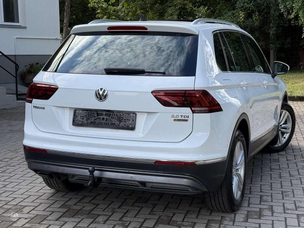 White Volkswagen Tiguan 2016 in Prienai, with an engine capacity of 1.97 L and mileage of 229 thousand km for 14950 €, photo 9 on AUTOMOTO.COM.LV