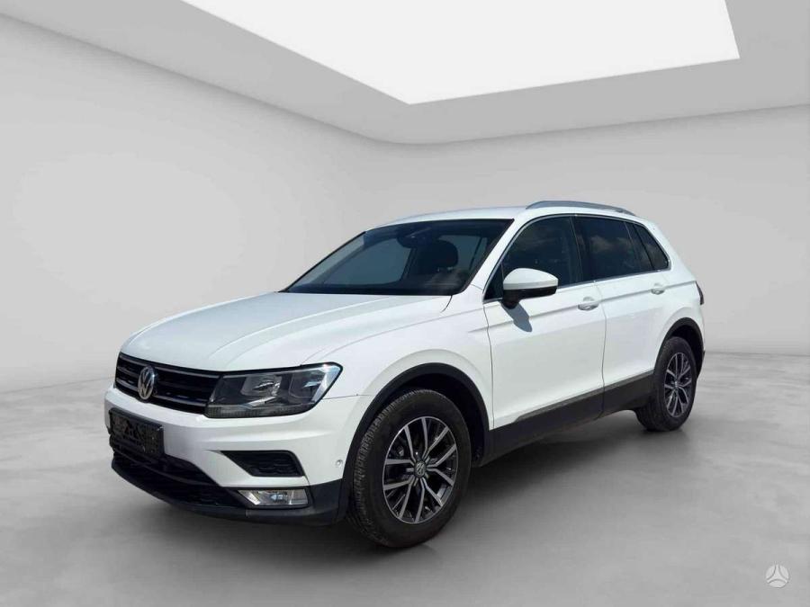 White Volkswagen Tiguan 2016 in Kaunas, with an engine capacity of 2.00 L and mileage of 235 thousand km for 15790 €, photo 1 on AUTOMOTO.COM.LV