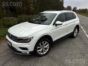 White Volkswagen Tiguan 2016 in Riga, with an engine capacity of 2.00 L and mileage of 190 thousand km for 14500 €, photo 4 on AUTOMOTO.COM.LV