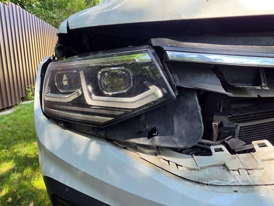 White Volkswagen Tiguan 2021 in Vilnius, with an engine capacity of 1.40 L and mileage of 98 thousand km for 18700 €, photo 14 on AUTOMOTO.COM.LV