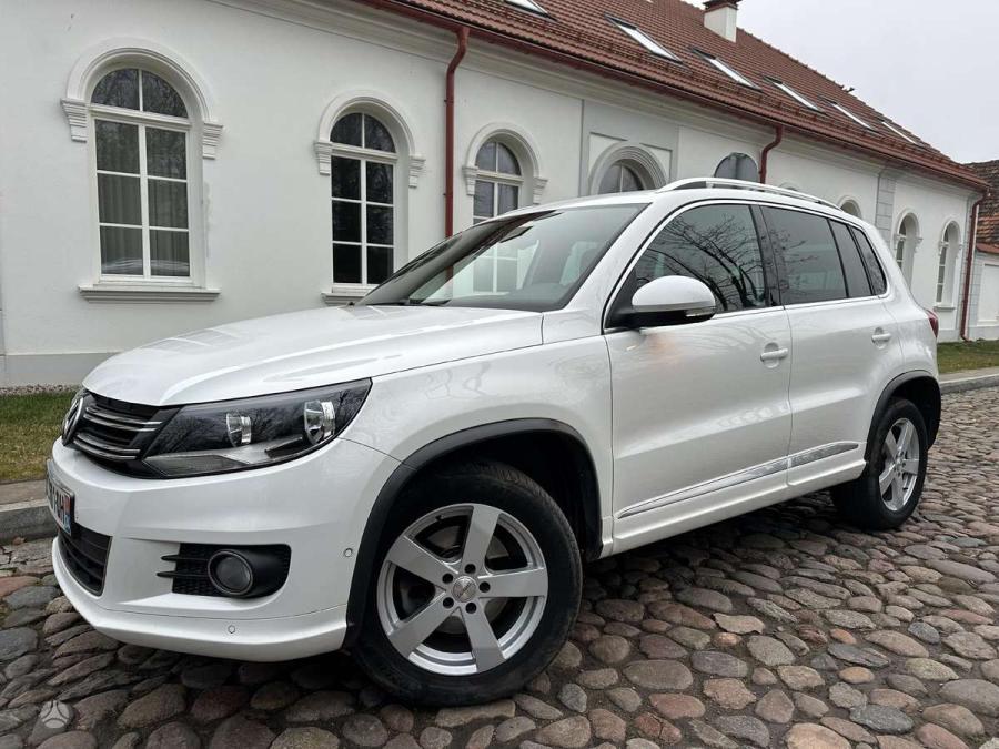 Yellow Volkswagen Tiguan 2012 in Kaunas, with an engine capacity of 1.97 L and mileage of 230 thousand km for 9990 €, photo 1 on AUTOMOTO.COM.LV