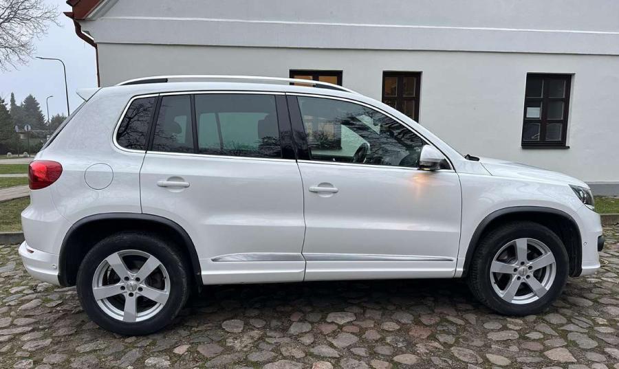Yellow Volkswagen Tiguan 2012 in Kaunas, with an engine capacity of 1.97 L and mileage of 230 thousand km for 9990 €, photo 6 on AUTOMOTO.COM.LV