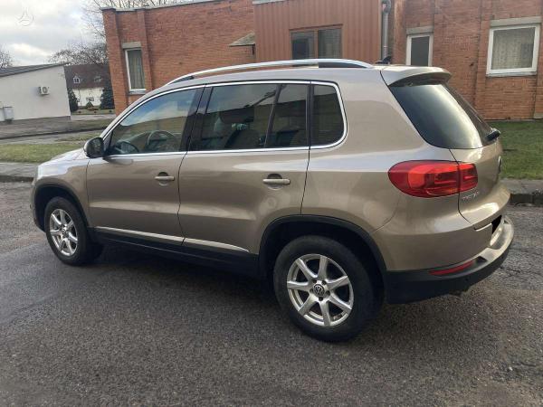 Yellow Volkswagen Tiguan 2013 in Marijampole, with an engine capacity of 1.97 L and mileage of 245 thousand km for 8450 €, photo 7 on AUTOMOTO.COM.LV