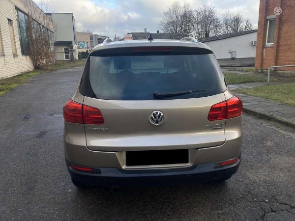 Yellow Volkswagen Tiguan 2013 in Marijampole, with an engine capacity of 1.97 L and mileage of 245 thousand km for 8450 €, photo 9 on AUTOMOTO.COM.LV