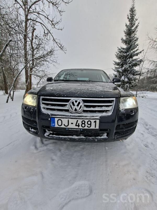 Black Volkswagen Touareg 2005 in Riga, with an engine capacity of 3.00 L and mileage of 169 thousand km for 4350 €, photo 2 on AUTOMOTO.COM.LV