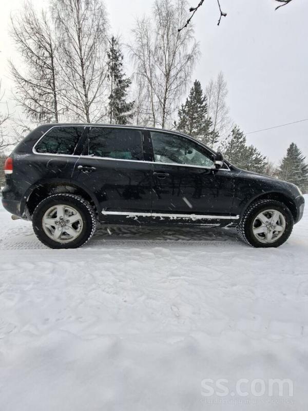 Black Volkswagen Touareg 2005 in Riga, with an engine capacity of 3.00 L and mileage of 169 thousand km for 4350 €, photo 4 on AUTOMOTO.COM.LV