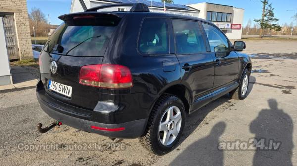Black Volkswagen Touareg 2005 in Jogeva, with an engine capacity of 3.00 L and mileage of 339 thousand km for 4200 €, photo 1 on AUTOMOTO.COM.LV