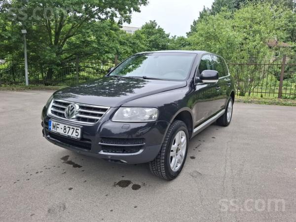 Melns Volkswagen Touareg 2005 Rīga, ar dzinēja tilpumu 3.00 L un nobraukumu 345 tūkst. km par 4200 €, foto 1 vietnē AUTOMOTO.COM.LV