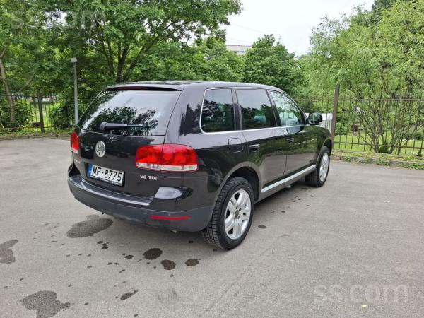 Melns Volkswagen Touareg 2005 Rīga, ar dzinēja tilpumu 3.00 L un nobraukumu 345 tūkst. km par 4200 €, foto 4 vietnē AUTOMOTO.COM.LV