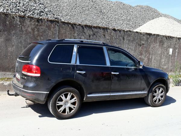 Black Volkswagen Touareg 2005 in Tallinn, with an engine capacity of 3.00 L and mileage of 316 thousand km for 1199 €, photo 10 on AUTOMOTO.COM.LV