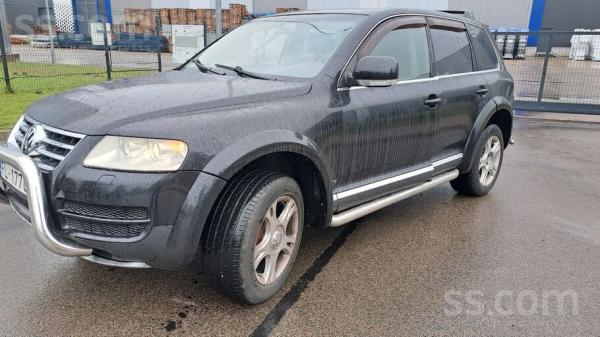 Melns Volkswagen Touareg 2005 Rīga, ar dzinēja tilpumu 3.00 L un nobraukumu 327 tūkst. km par 3200 €, foto 4 vietnē AUTOMOTO.COM.LV