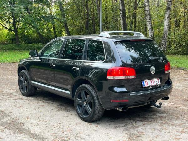 Volkswagen Touareg 2005 Rīga vietnē Melns Volkswagen Touareg 2005 Rīga, ar dzinēja tilpumu 2.50 L un nobraukumu 0 tūkst. km par 3799 €, foto 4 vietnē AUTOMOTO.COM.LV