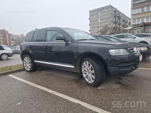Black Volkswagen Touareg 2006 in Daugavpils, with an engine capacity of 3.00 L and mileage of 248 thousand km for 6250 €, photo 1 on AUTOMOTO.COM.LV