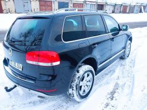 Black Volkswagen Touareg 2006 in Utena, with an engine capacity of 2.97 L and mileage of 245 thousand km for 5400 €, photo 14 on AUTOMOTO.COM.LV