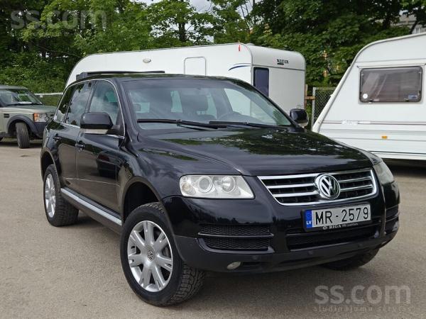 Black Volkswagen Touareg 2006 in Riga, with an engine capacity of 3.00 L and mileage of 282 thousand km for 3500 €, photo 1 on AUTOMOTO.COM.LV