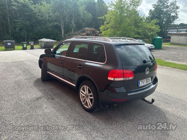 Melns Volkswagen Touareg 2006 Tallina, ar dzinēja tilpumu 2.50 L un nobraukumu 354 tūkst. km par 2500 €, foto 5 vietnē AUTOMOTO.COM.LV
