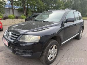 Black Volkswagen Touareg 2006 in Riga, with an engine capacity of 3.00 L and mileage of 322 thousand km for 2950 €, photo  on AUTOMOTO.COM.LV