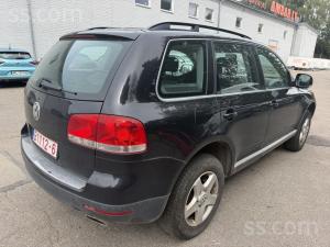 Black Volkswagen Touareg 2006 in Riga, with an engine capacity of 3.00 L and mileage of 322 thousand km for 2950 €, photo 4 on AUTOMOTO.COM.LV