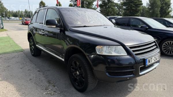 Melns Volkswagen Touareg 2006 Rīga, ar dzinēja tilpumu 3.00 L un nobraukumu 322 tūkst. km par 2000 €, foto 3 vietnē AUTOMOTO.COM.LV