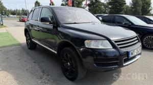 Black Volkswagen Touareg 2006 in Riga, with an engine capacity of 3.00 L and mileage of 322 thousand km for 2000 €, photo 3 on AUTOMOTO.COM.LV