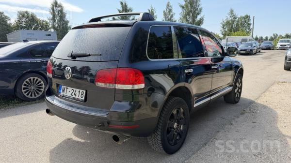 Melns Volkswagen Touareg 2006 Rīga, ar dzinēja tilpumu 3.00 L un nobraukumu 322 tūkst. km par 2000 €, foto 4 vietnē AUTOMOTO.COM.LV