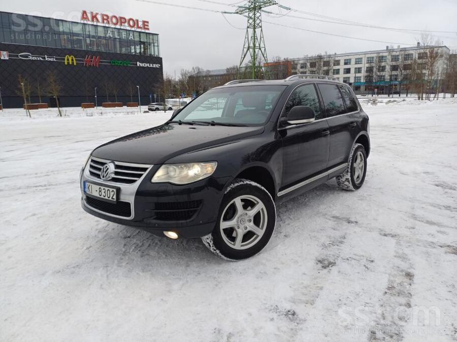 Black Volkswagen Touareg 2007 in Riga, with an engine capacity of 3.00 L and mileage of 261 thousand km for 6200 €, photo 1 on AUTOMOTO.COM.LV