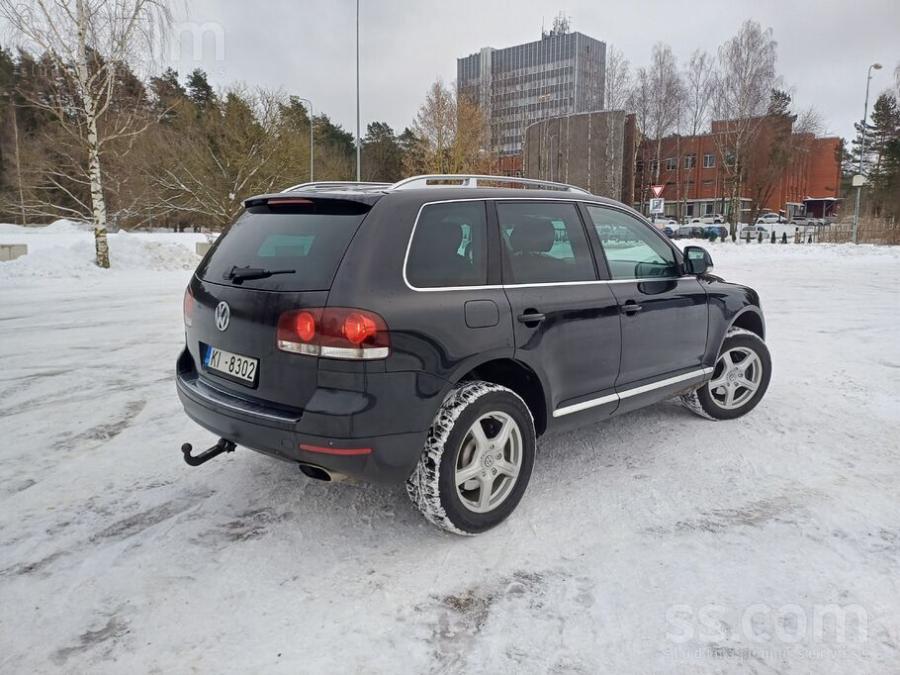 Black Volkswagen Touareg 2007 in Riga, with an engine capacity of 3.00 L and mileage of 261 thousand km for 6200 €, photo 3 on AUTOMOTO.COM.LV