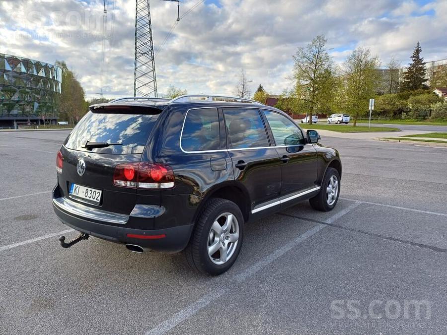 Black Volkswagen Touareg 2007 in Riga, with an engine capacity of 3.00 L and mileage of 261 thousand km for 6200 €, photo 11 on AUTOMOTO.COM.LV