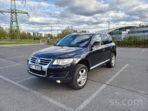 Black Volkswagen Touareg 2007 in Riga, with an engine capacity of 3.00 L and mileage of 261 thousand km for 6200 €, photo 12 on AUTOMOTO.COM.LV