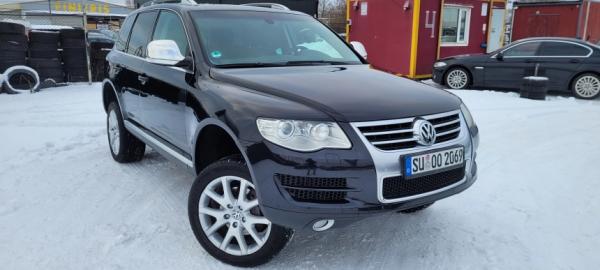 Black Volkswagen Touareg 2007 in Riga, with an engine capacity of 3.00 L and mileage of 327 thousand km for 6900 €, photo 3 on AUTOMOTO.COM.LV