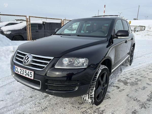 Black Volkswagen Touareg 2007 in Vilnius, with an engine capacity of 4.92 L and mileage of 284 thousand km for 2999 €, photo 1 on AUTOMOTO.COM.LV