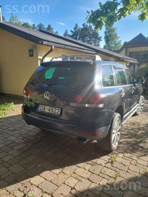Black Volkswagen Touareg 2007 in Riga, with an engine capacity of 3.00 L and mileage of 309 thousand km for 5400 €, photo  on AUTOMOTO.COM.LV