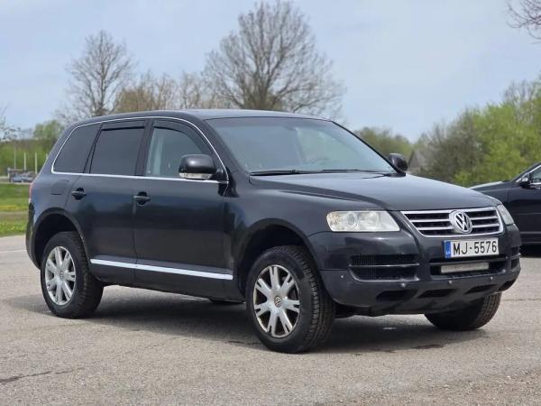 Black Volkswagen Touareg 2007 in Grobiņa, with an engine capacity of 3.00 L and mileage of 282 thousand km for 2990 €, photo 5 on AUTOMOTO.COM.LV