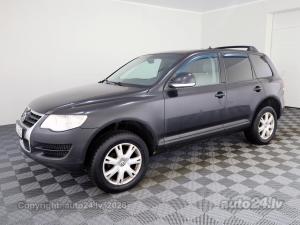 Black Volkswagen Touareg 2007 in Tallinn, with an engine capacity of 2.50 L and mileage of 259 thousand km for 1499 €, photo 3 on AUTOMOTO.COM.LV