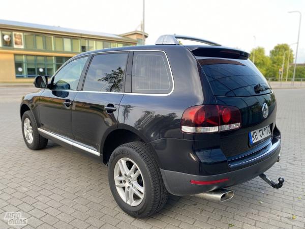 Black Volkswagen Touareg 2008 in Utena, with an engine capacity of 3.00 L and mileage of 311 thousand km for 7950 €, photo 1 on AUTOMOTO.COM.LV
