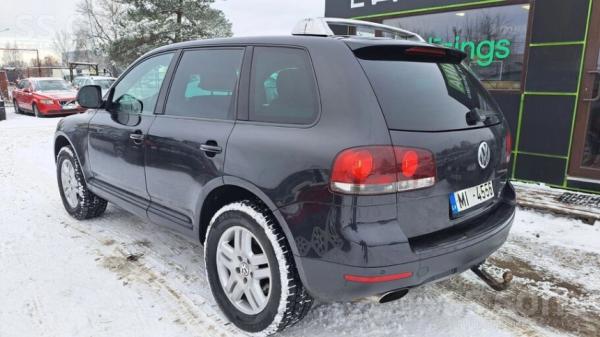 Black Volkswagen Touareg 2008 in Riga, with an engine capacity of 3.00 L and mileage of 319 thousand km for 6500 €, photo 4 on AUTOMOTO.COM.LV
