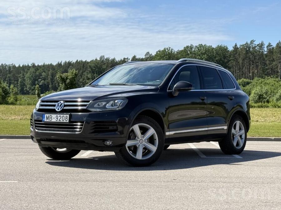 Black Volkswagen Touareg 2009 in Riga, with an engine capacity of 3.00 L and mileage of 386 thousand km for 7900 €, photo 1 on AUTOMOTO.COM.LV