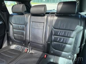 Black Volkswagen Touareg 2009 in Riga, with an engine capacity of 3.00 L and mileage of 386 thousand km for 7900 €, photo 9 on AUTOMOTO.COM.LV